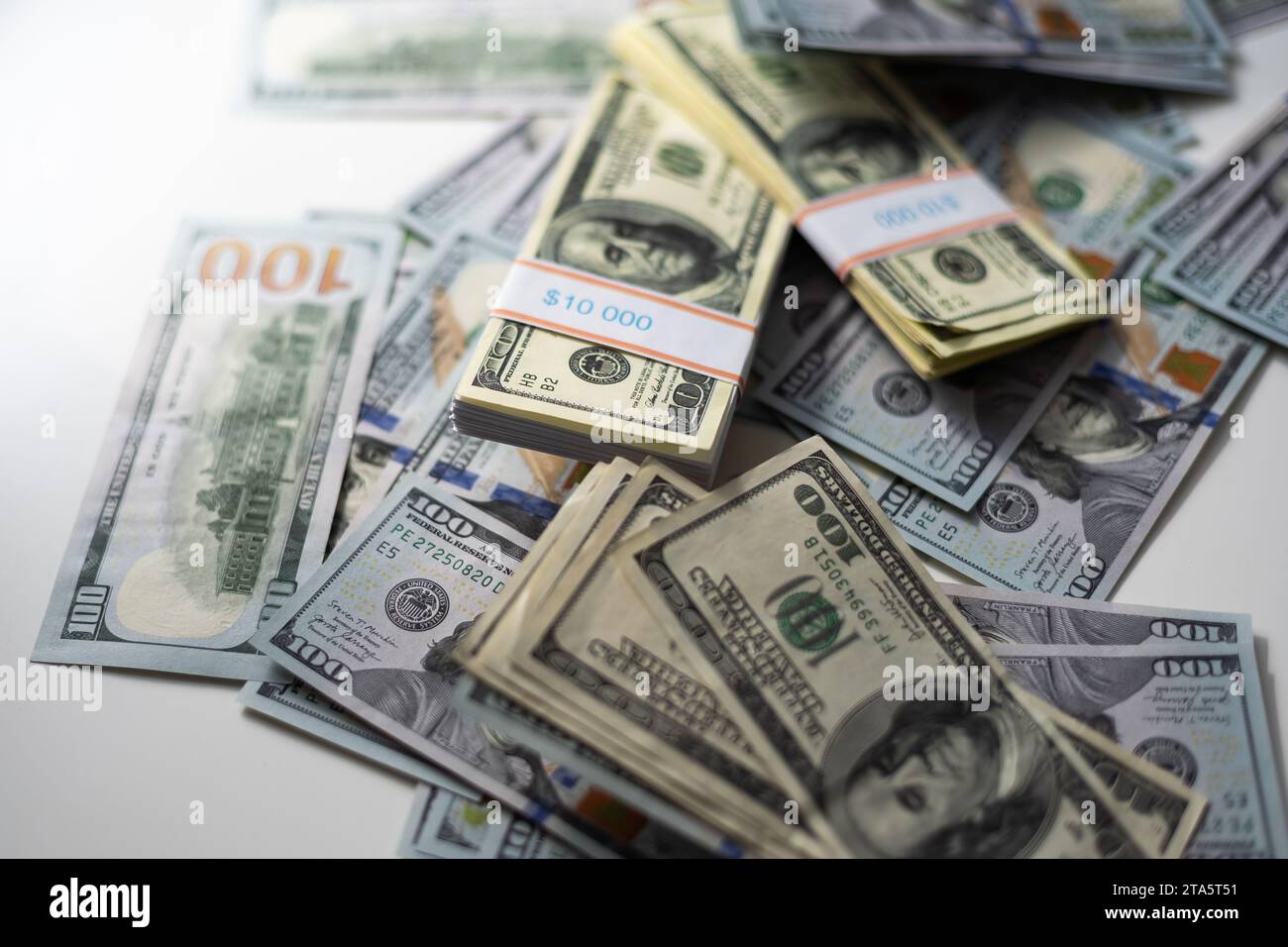 Cash money in a large pile as a finance background. Paper money close ...