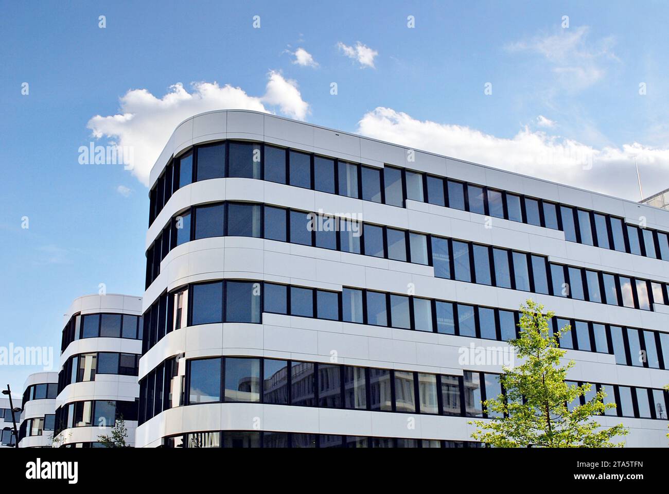 Glass building with transparent facade of the building and blue sky ...