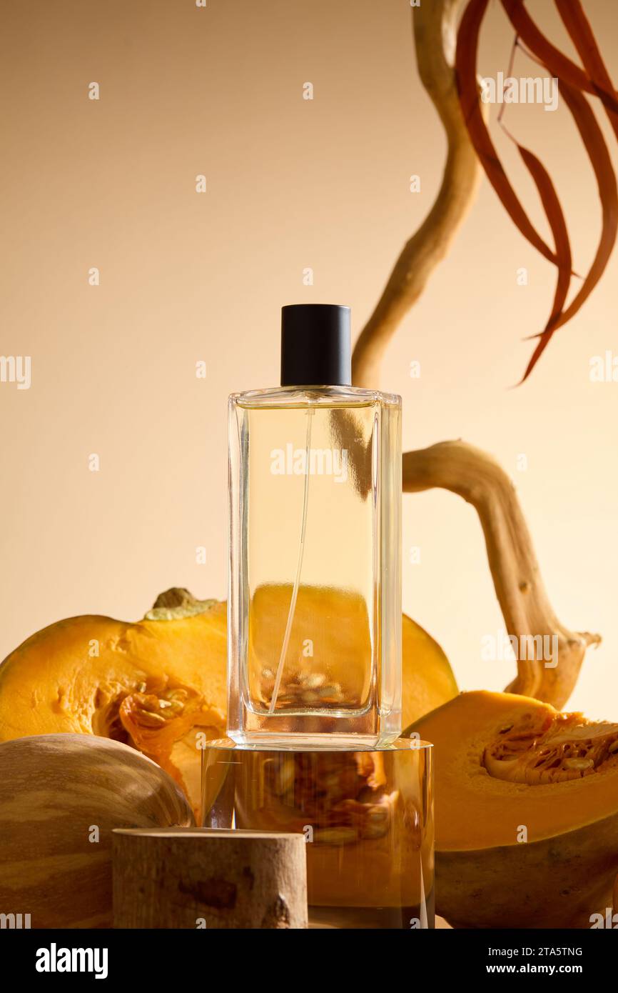 Front view of glass perfume bottle displayed on transparent podium ...