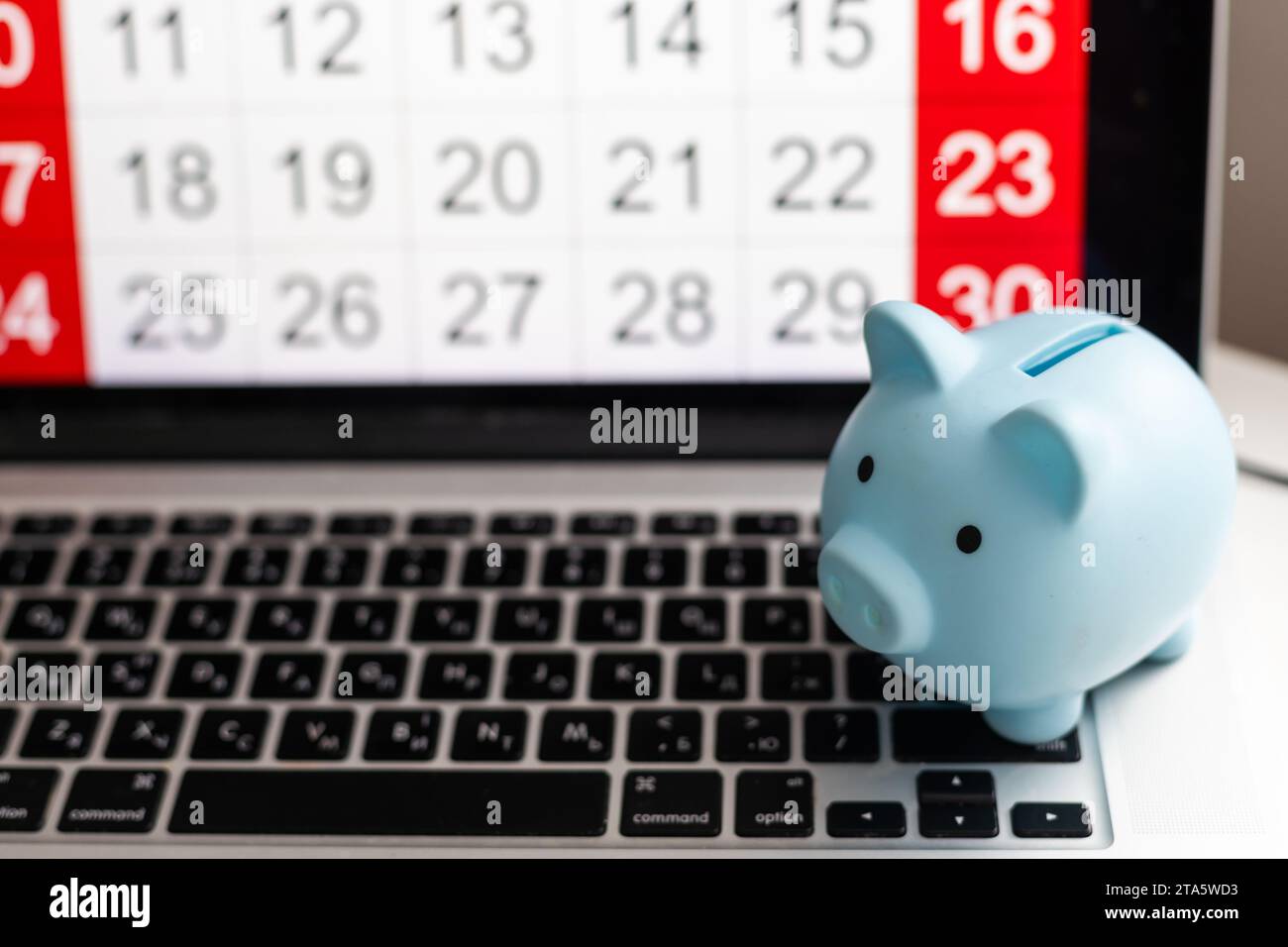 White piggy bank on monthly calendar year 2020 on white background ...