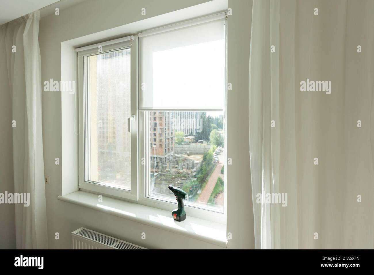 Plastic window of the three wings. A window in an empty room Stock ...