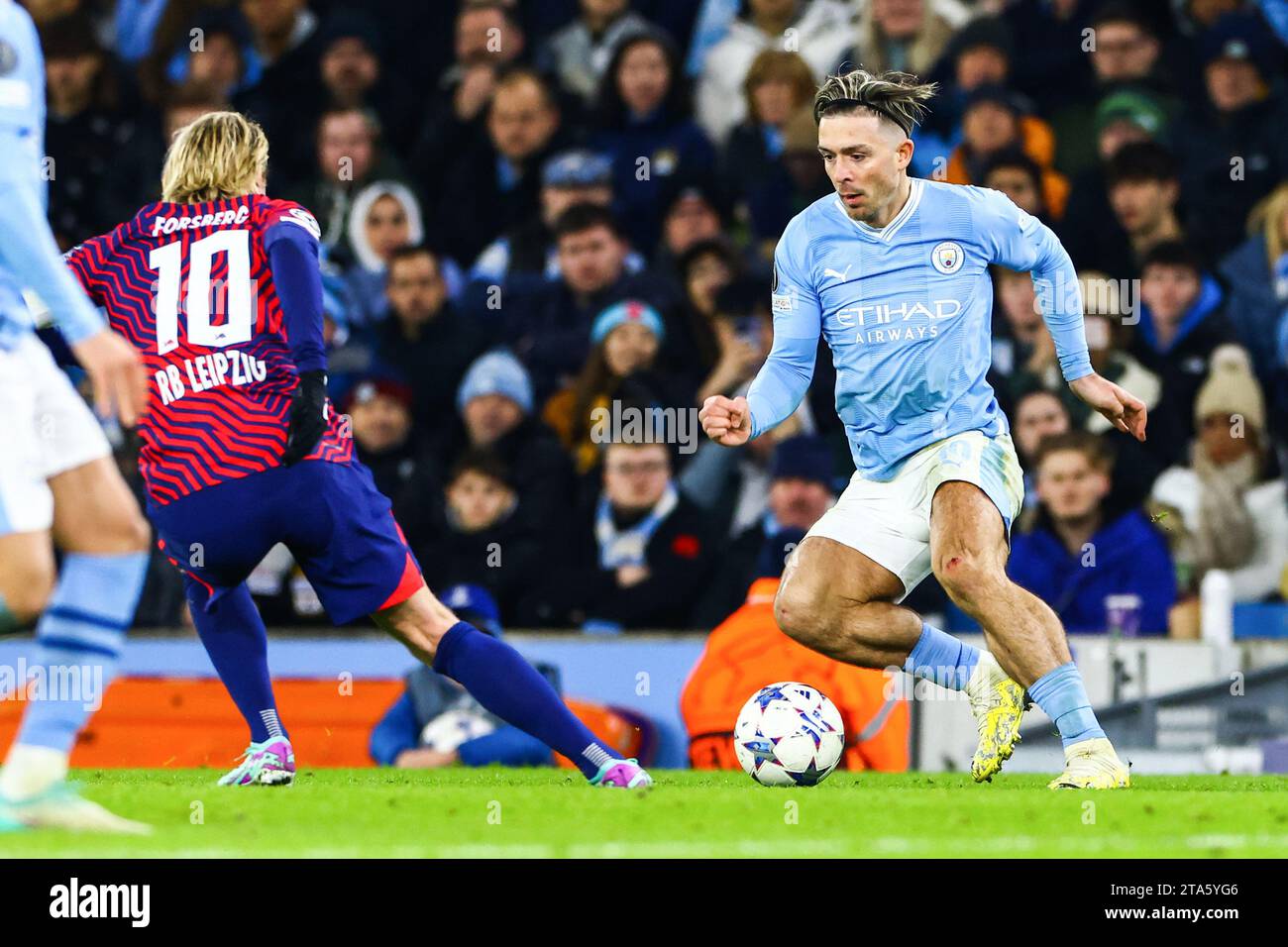 Manchester, UK. 29th Nov, 2023. Jack Grealish of Manchester City takes on Emil Forsberg of RB ...