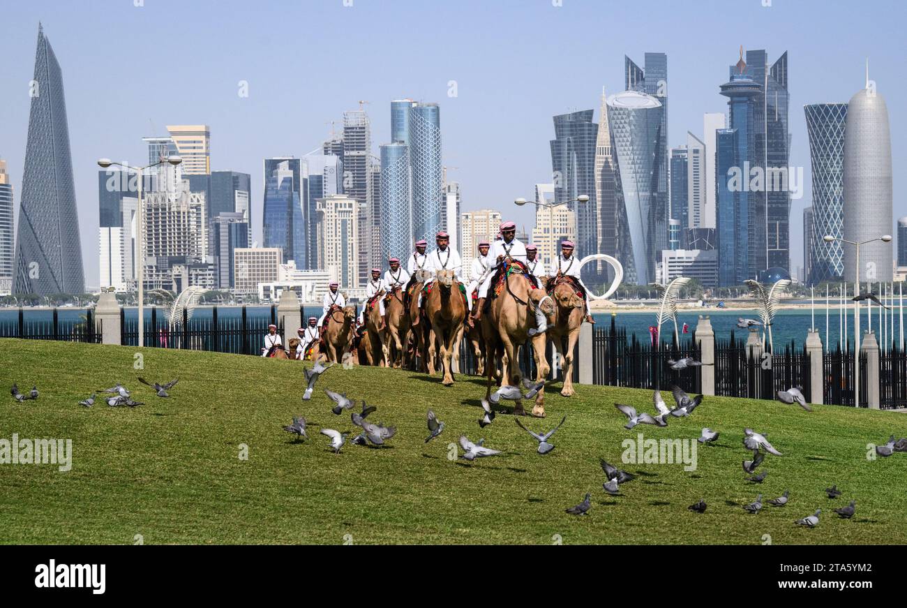 Doha, Qatar. 29th Nov, 2023. The Qatari Emir's honor guard rides camels ...