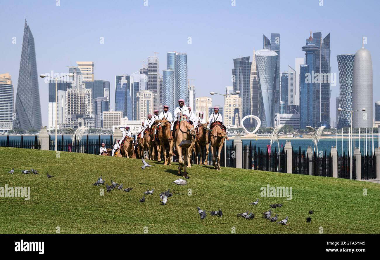 Doha, Qatar. 29th Nov, 2023. The Qatari Emir's honor guard rides camels ...