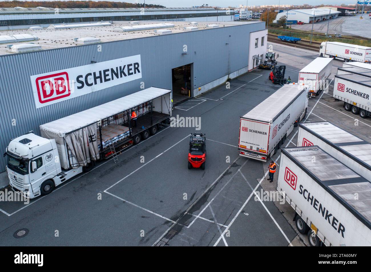 Rostock, Germany. 21st Nov, 2023. Trucks of the logistics company DB ...