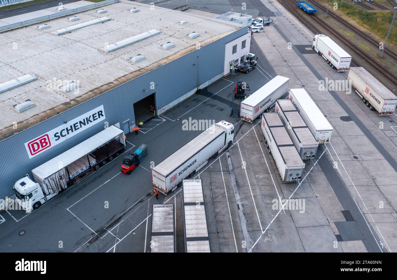 Rostock, Germany. 21st Nov, 2023. Trucks of the logistics company DB ...
