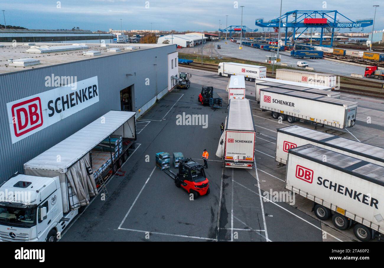 Rostock, Germany. 21st Nov, 2023. Trucks of the logistics company DB ...