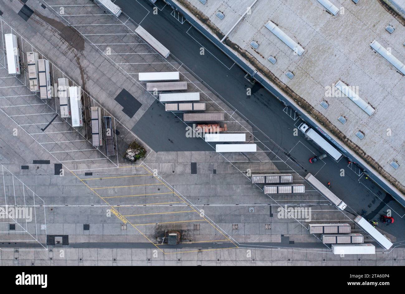 Rostock, Germany. 21st Nov, 2023. Trucks of the logistics company DB ...