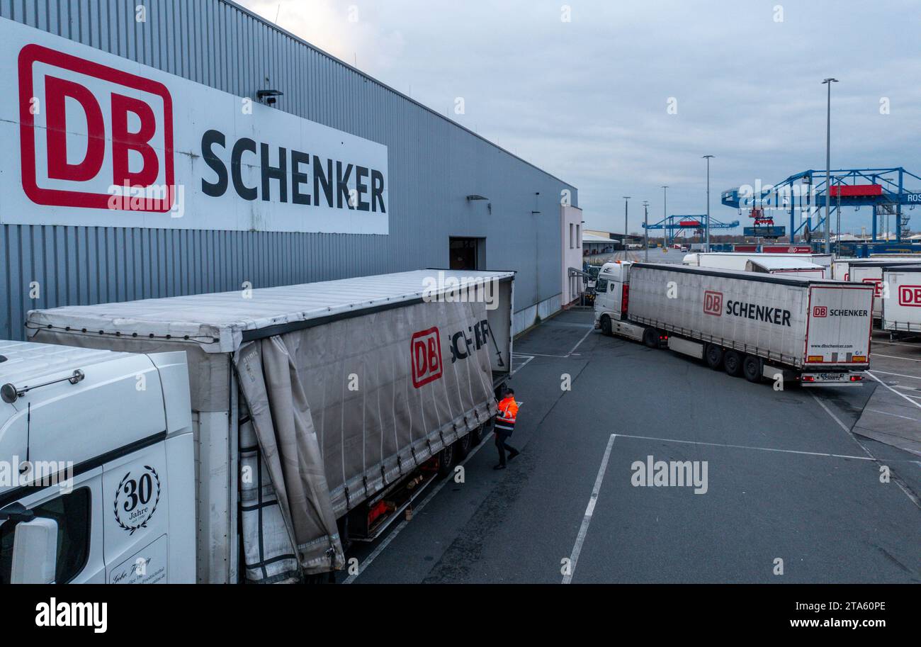 Rostock, Germany. 21st Nov, 2023. Trucks of the logistics company DB ...