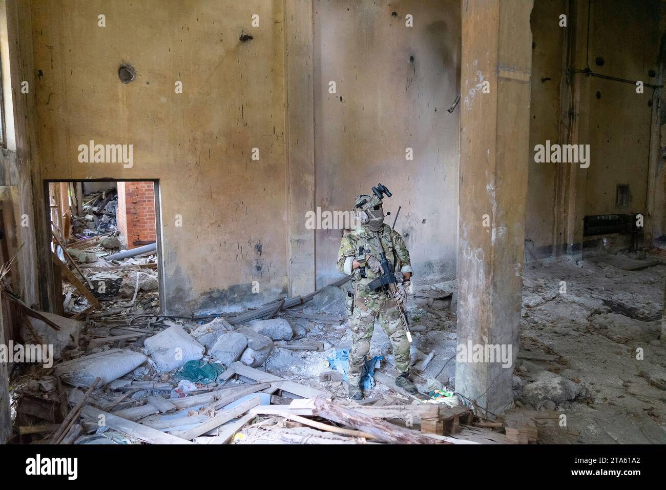 Soldier in civil war, ruined building. Close quarter battle and civil ...