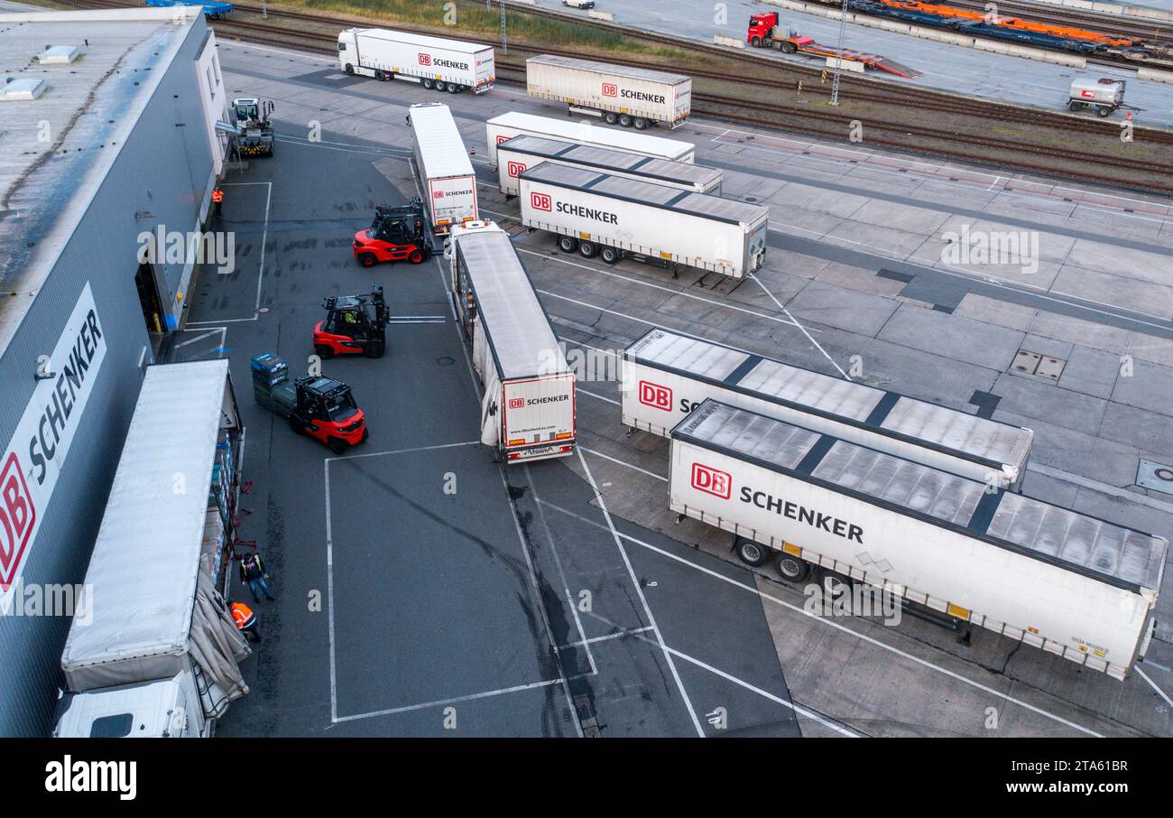 Rostock, Germany. 21st Nov, 2023. Trucks of the logistics company DB ...