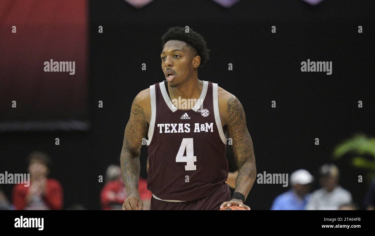 Texas A&M guard Wade Taylor IV (4) brings the ball up the court during ...