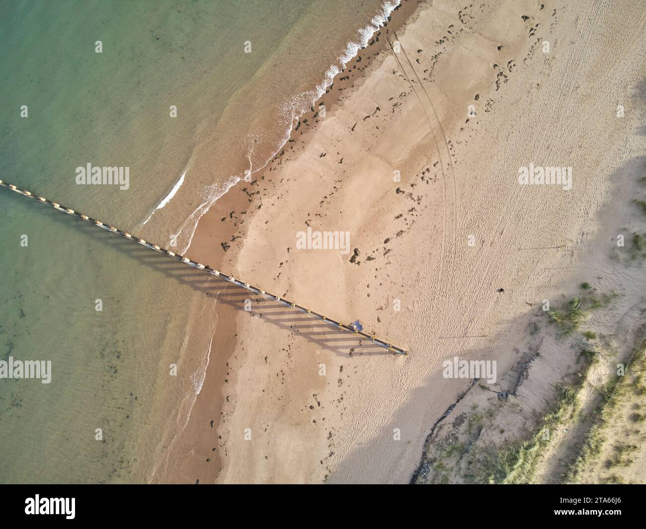 An aerial view of the beach and a groyne, at Dawlish Warren, near ...