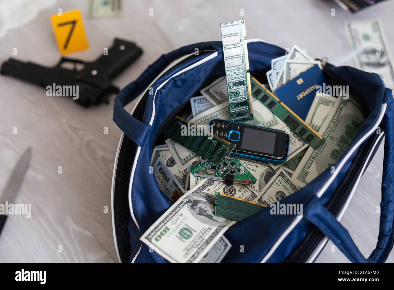 Black duffel bag full of dollar notes in criminal investigation unit ...