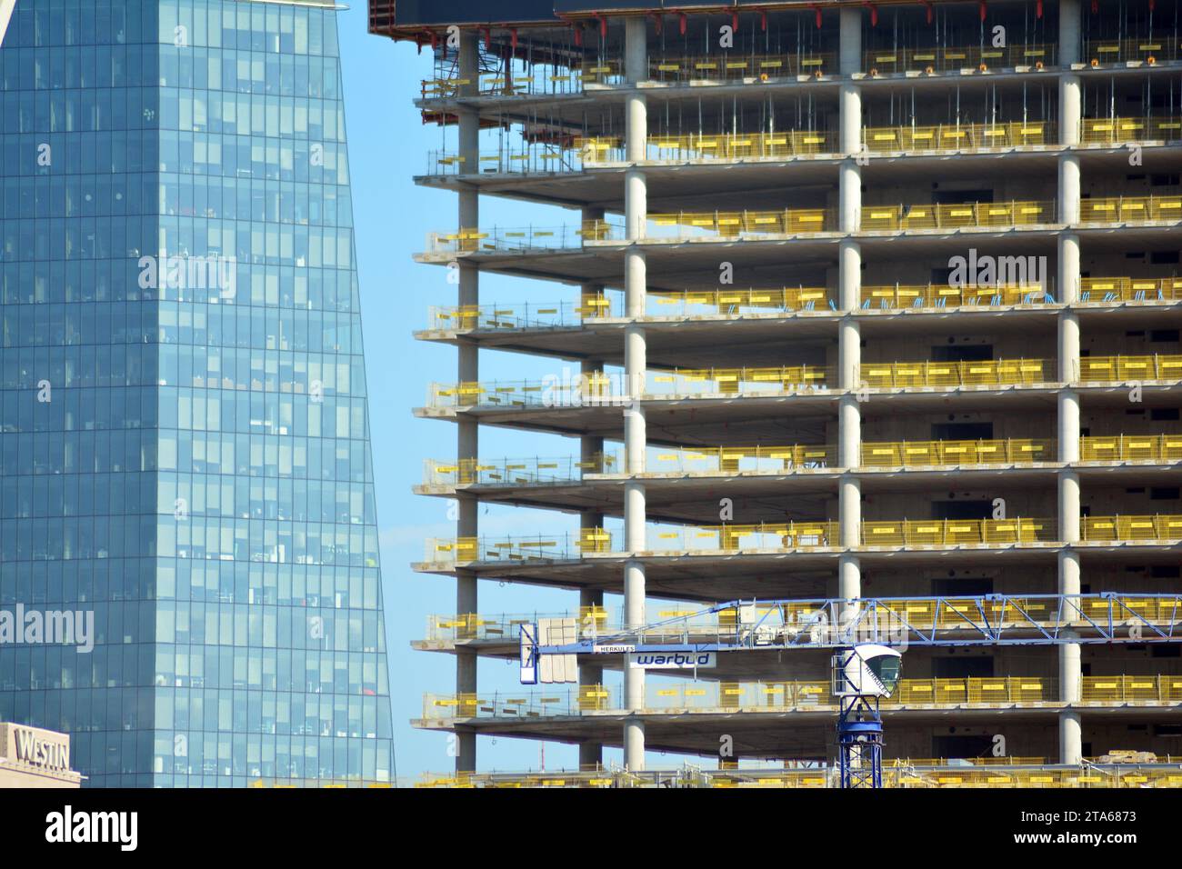 High rise building under construction. Installation of glass facade ...