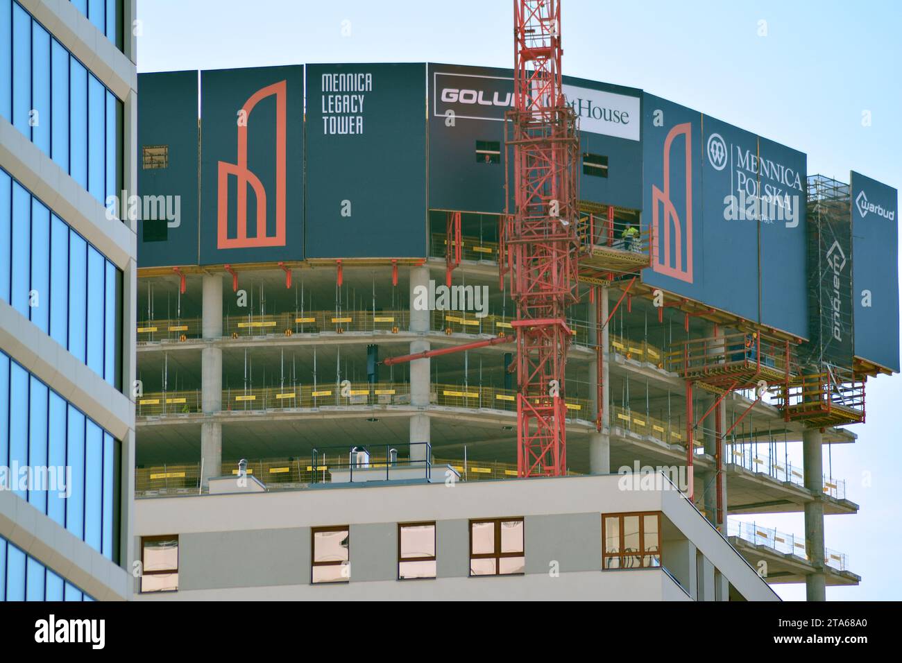 High rise building under construction. Installation of glass facade ...