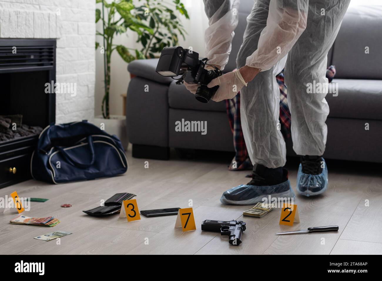 Criminological expert collecting evidence at the crime scene Stock Photo - Alamy