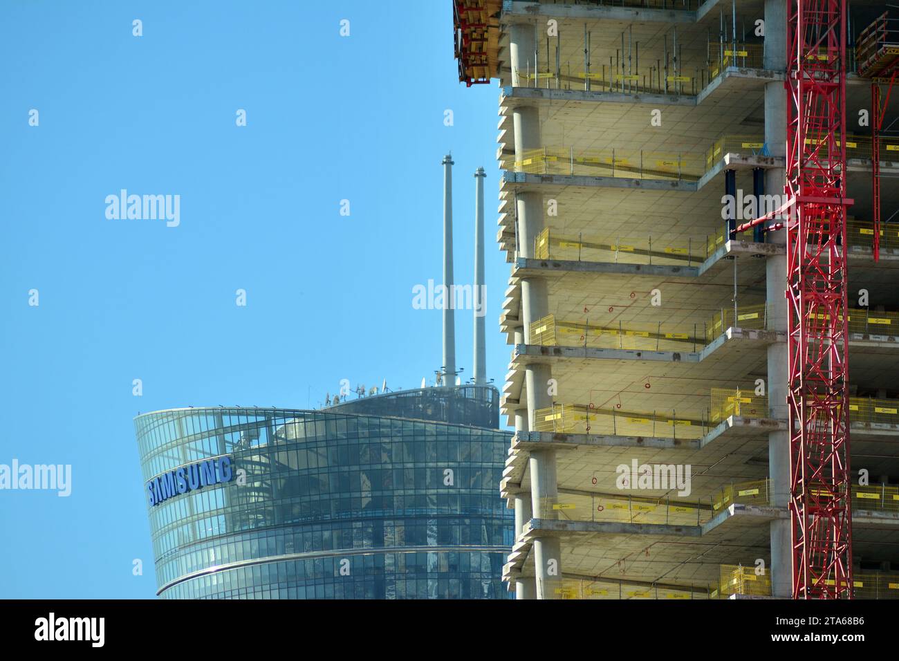 High rise building under construction. Installation of glass facade ...