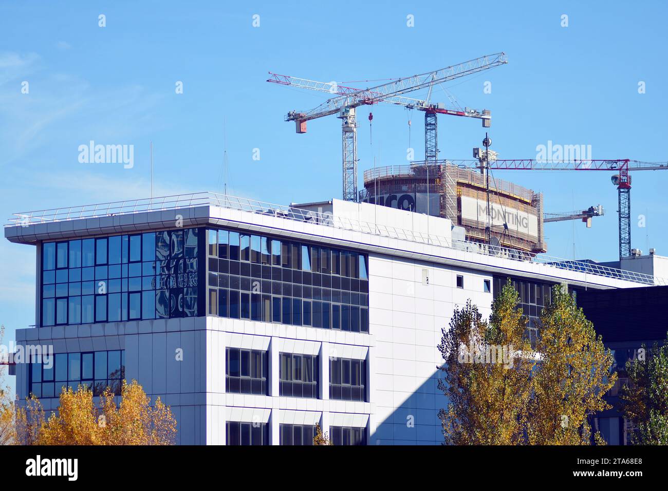 High rise building under construction. Installation of glass facade ...