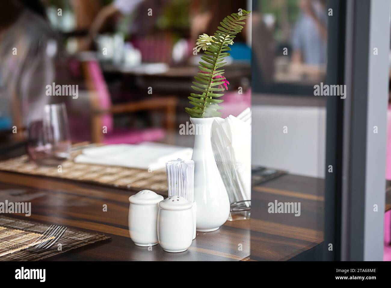 Hotel restaurant space with tables set for dinner at luxury resort ...