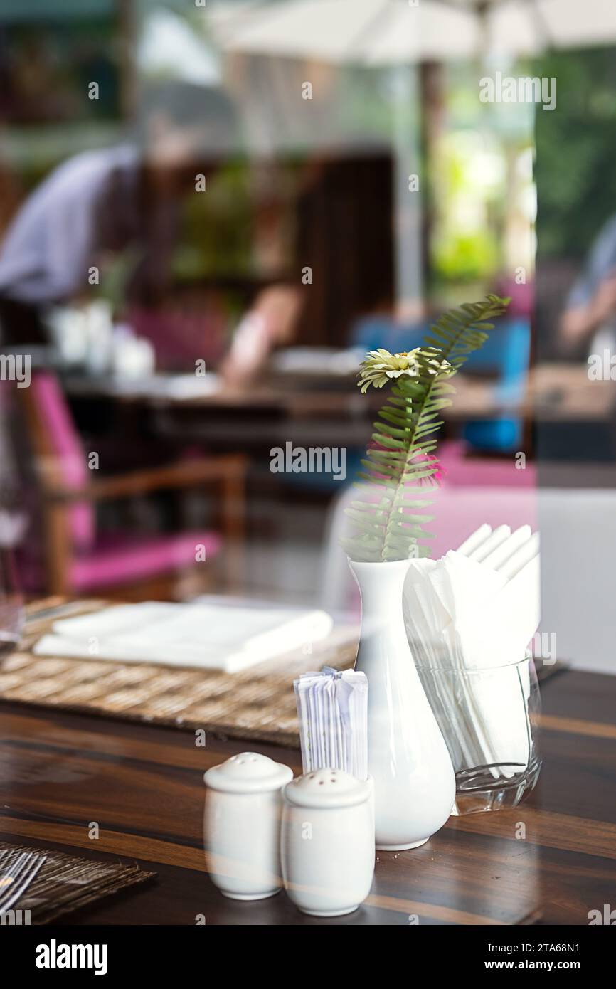 Hotel restaurant space with tables set for dinner at luxury resort ...