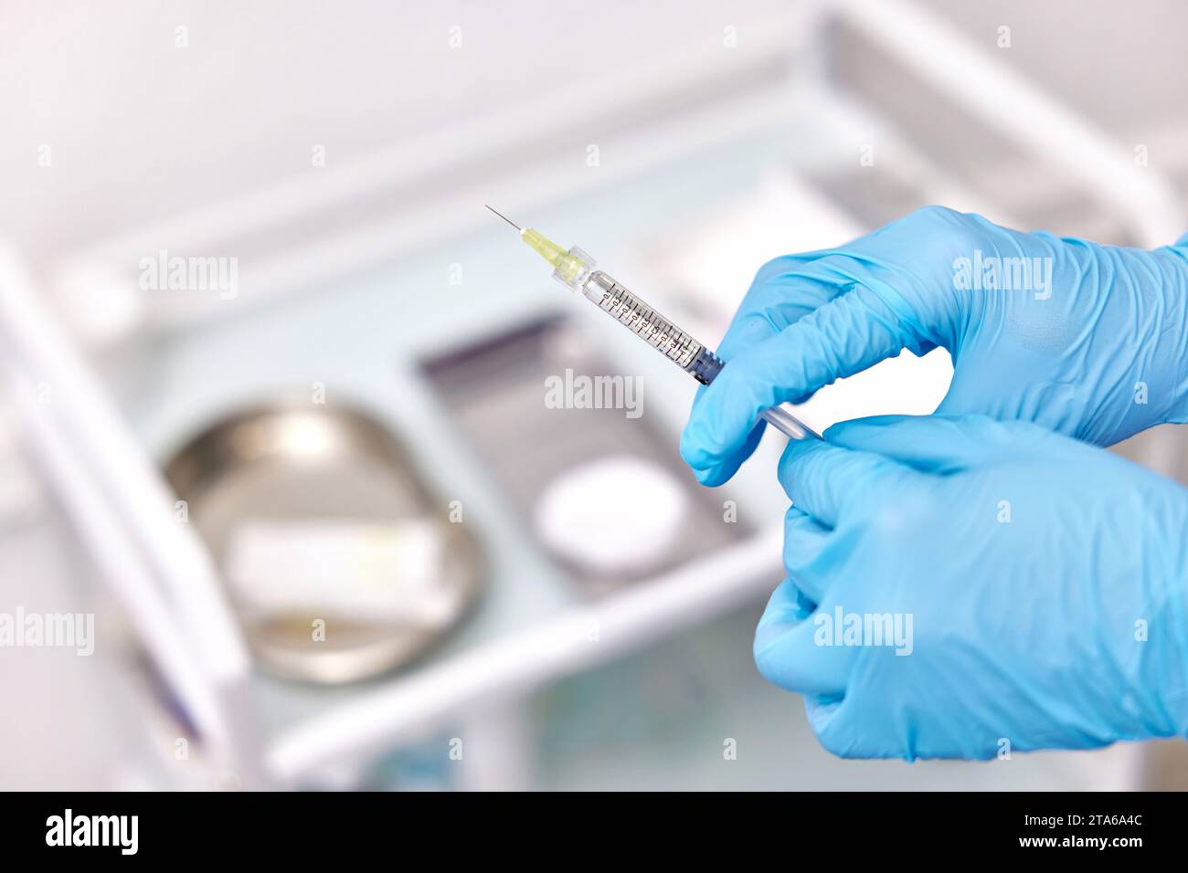 Physician hand in blue gloves with syringe for injection Stock Photo ...