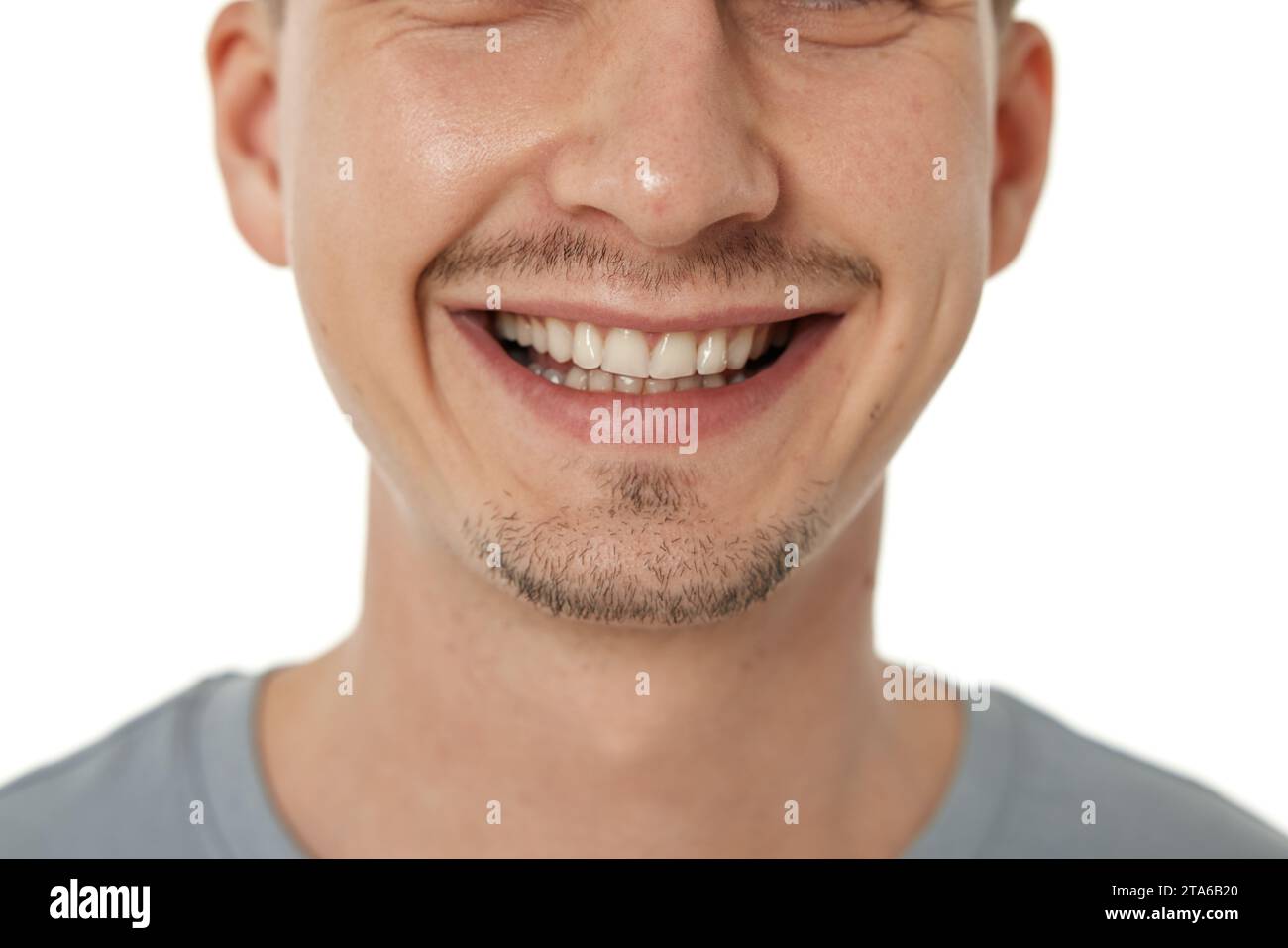 mouth and teeth of smiling man on studio background. male face with ...