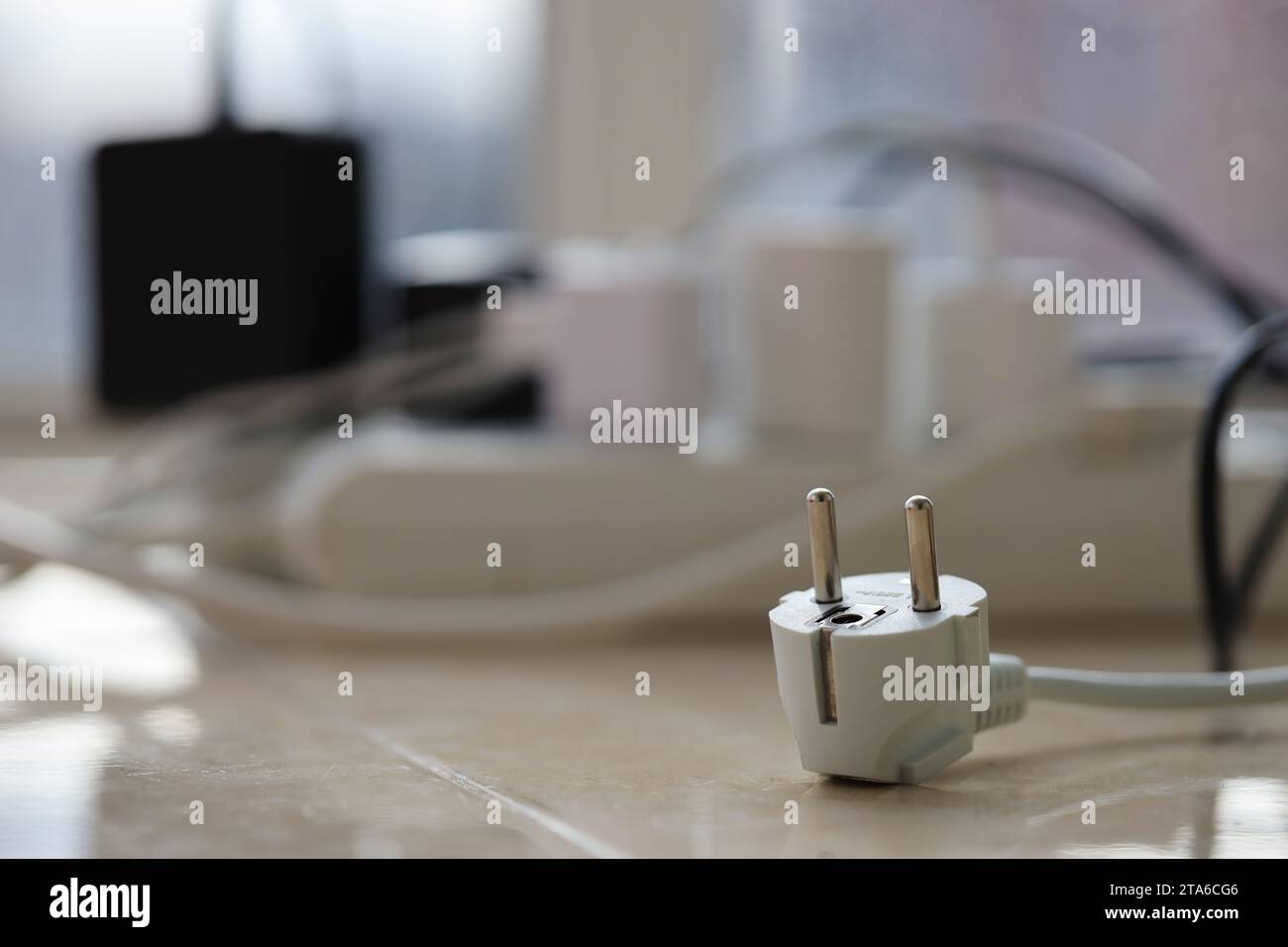 Overloaded power boards. Power strips with different electrical plugs ...