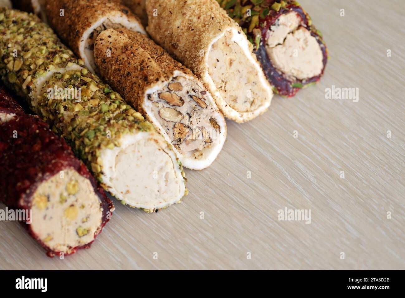 Rolls of turkish delight with many different flavors and fillings close ...