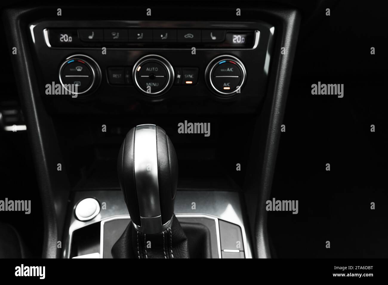 Gear lever and black climate control panel of a modern car. Close up ...