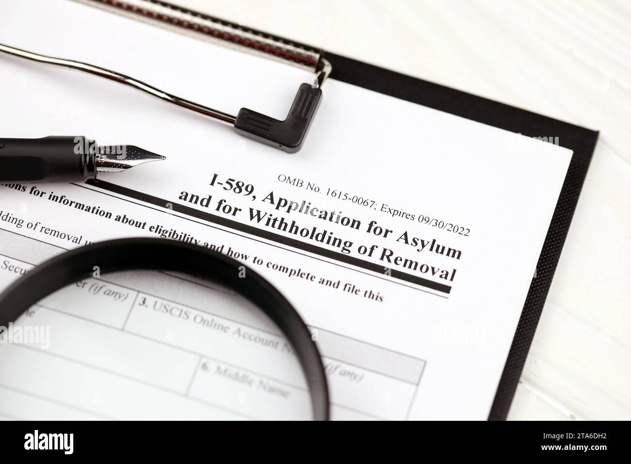I-589 Application for asylum and for withholding of removal blank form on A4 tablet, lies on ...