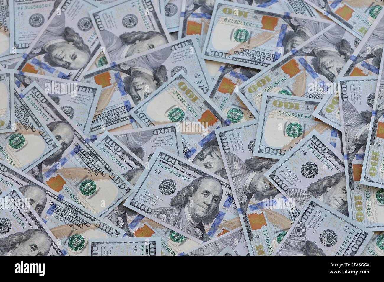 Very big amount of US hundred dollar bills close up. Huge quantity of ...