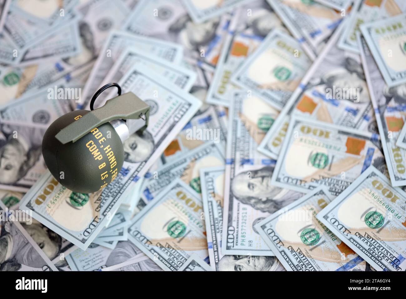 Grenade with a check against the background of huge amount of american ...