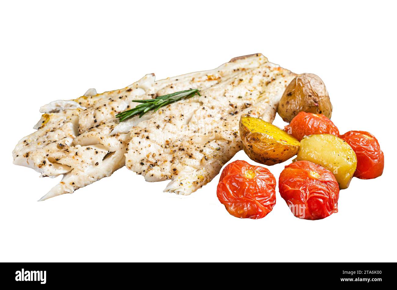 Baked Haddock fish fillet on wooden board with tomato and potato ...