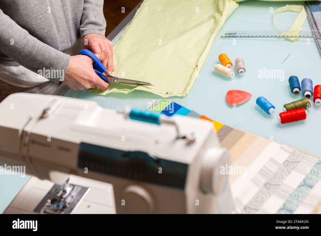 Woman tailor scissors cutting out hi-res stock photography and images ...