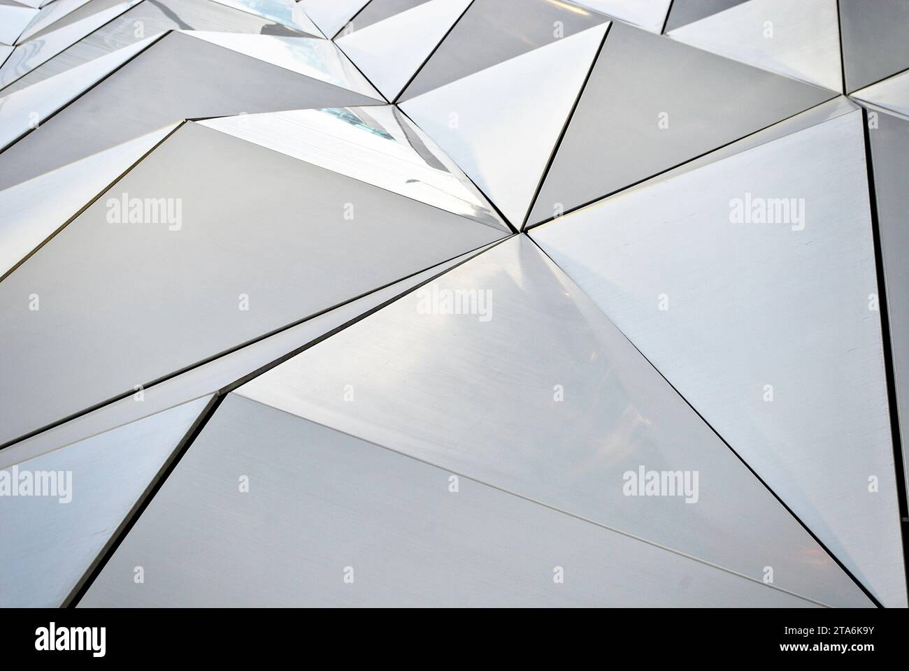 Modern office building with white metallic panel facade and windows ...