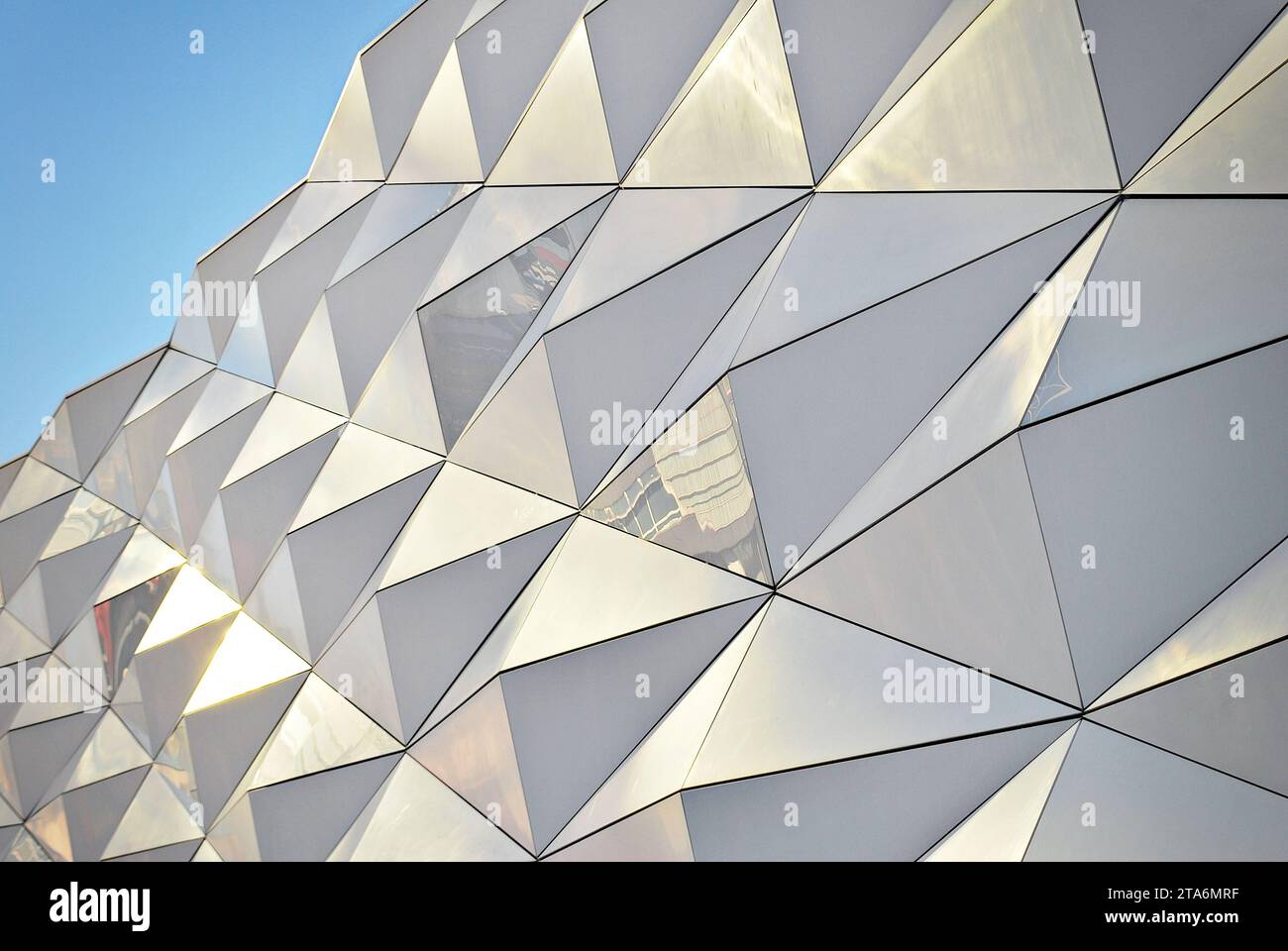 Modern office building with white metallic panel facade and windows ...