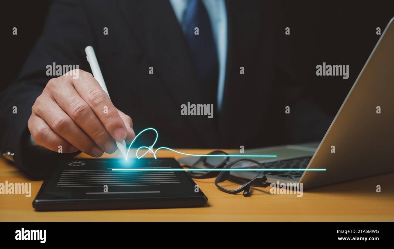 Businessman use electronic pen sign signature on electronic E-signing ...