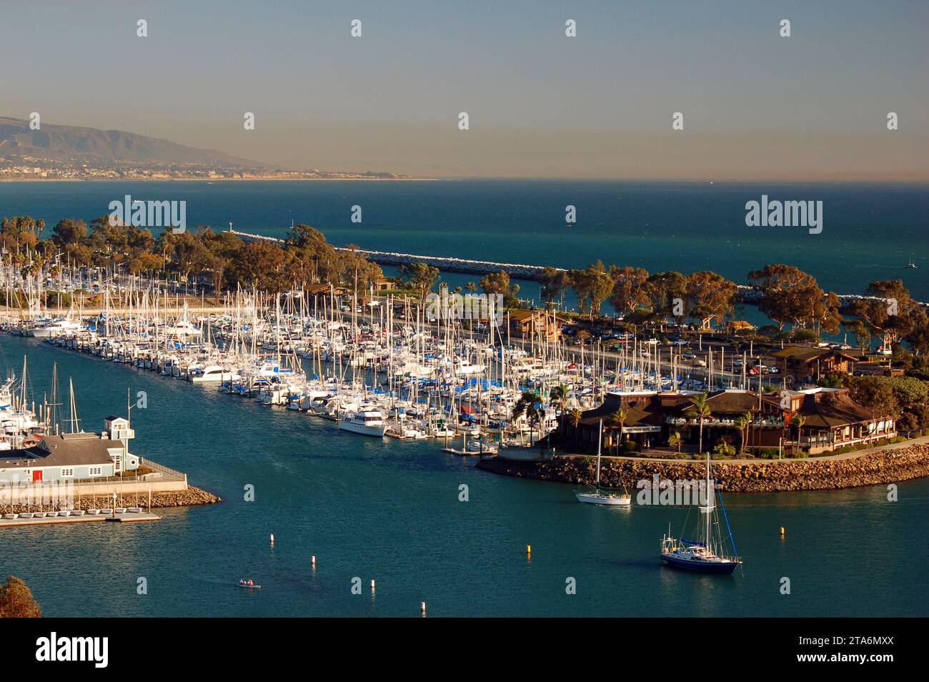 Sailboats, ships and other pleasure craft boats are tied at the marina ...