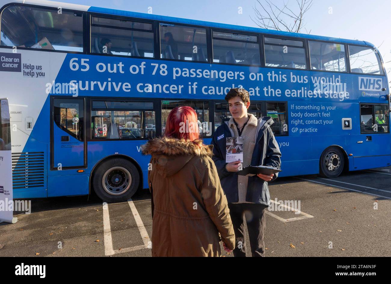 EDITORIAL USE ONLY Volunteers speak to members of the public as the ...