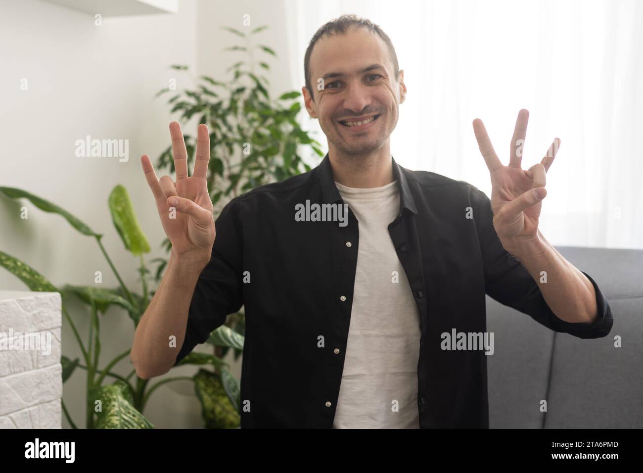 Adult Learning Sign Language For Deaf Disabled Stock Photo - Alamy