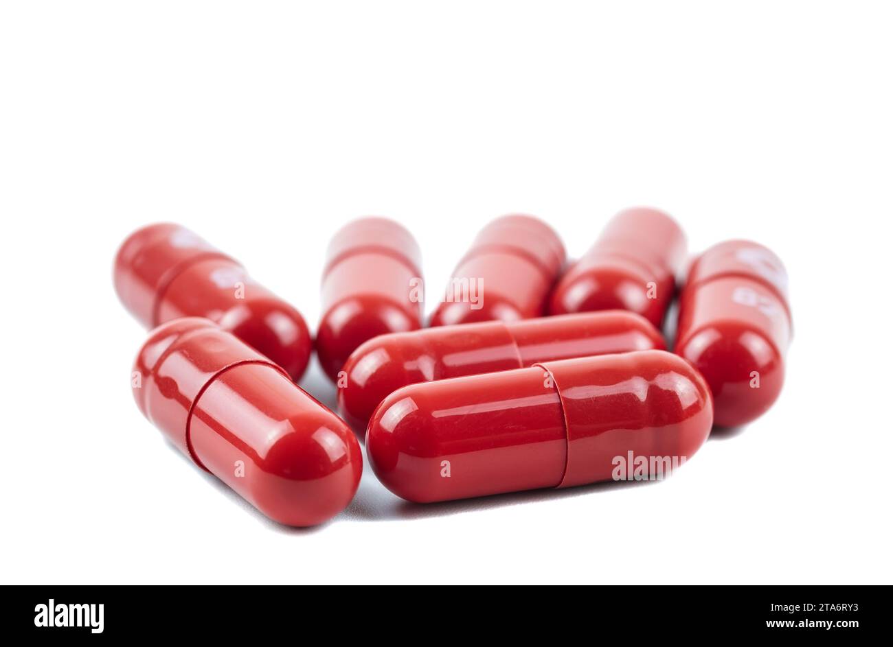 Closeup herbal powder medicine capsule pill isolated on white ...