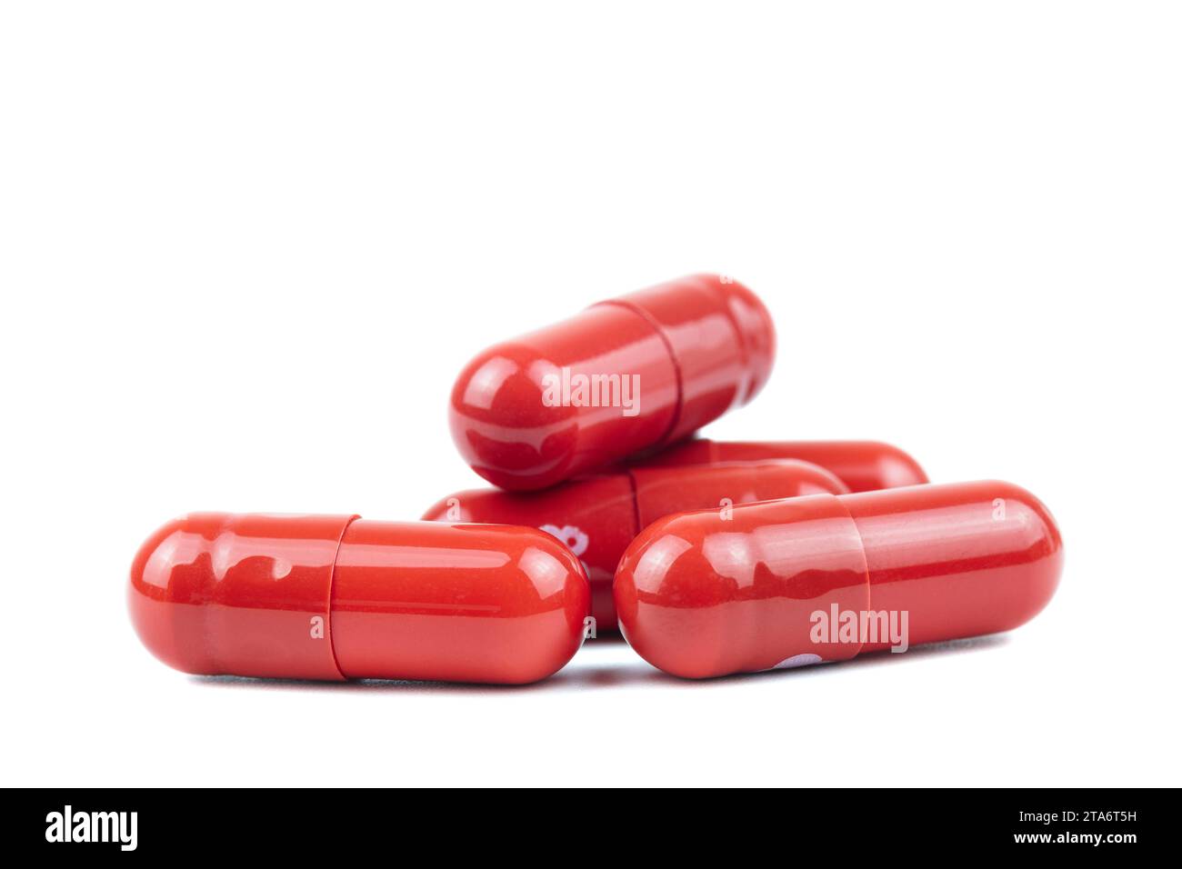 Closeup herbal powder medicine capsule pill isolated on white ...