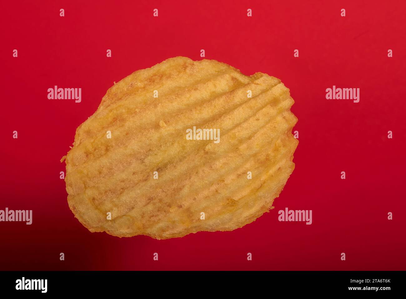 Close up snack food still life of crinkle cut crisps Stock Photo - Alamy