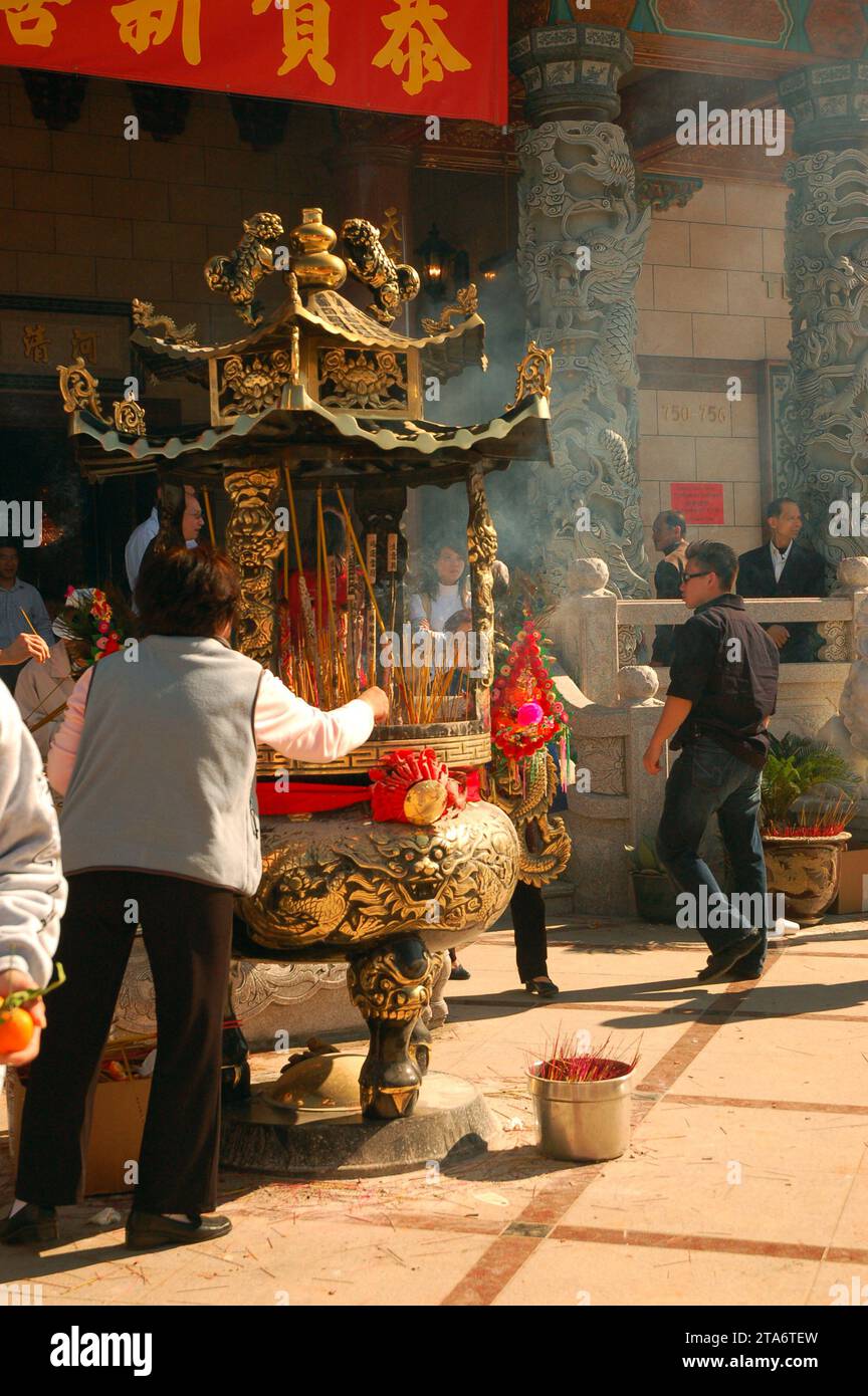 Worshipers celebrate the Lunar New Year with prayers and offerings at a ...