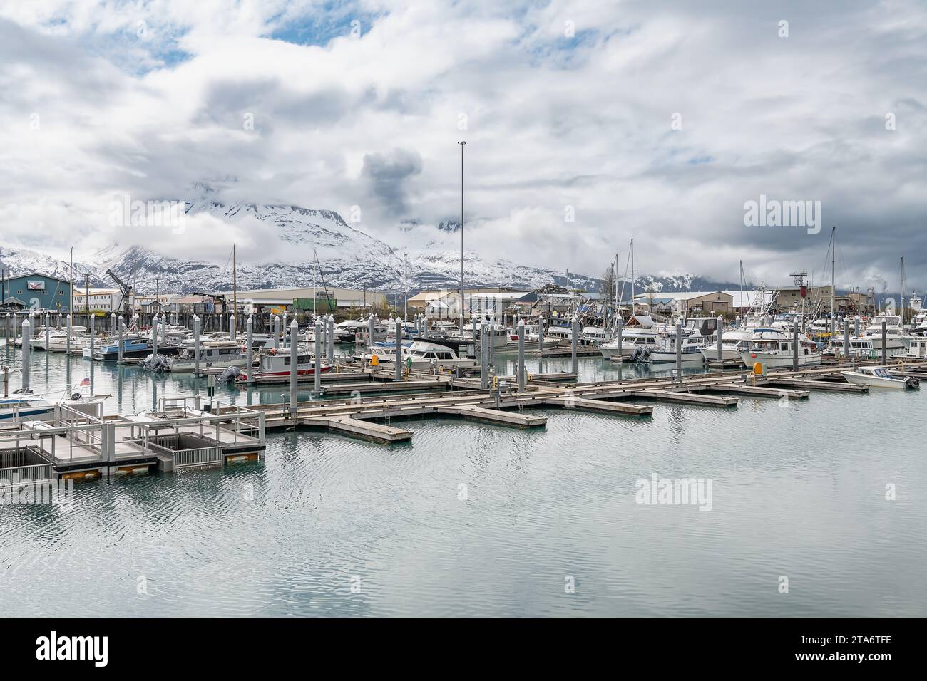 Valdez marina with snow and cloud covered mountains behind, Valdez ...