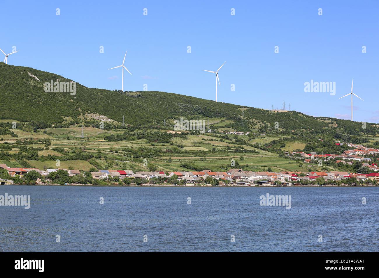 Coronini village & Moldova Noua onshore wind turbines farm on the hill ...