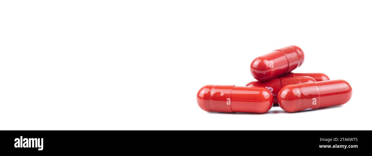 Closeup herbal powder medicine capsule pill isolated on white ...