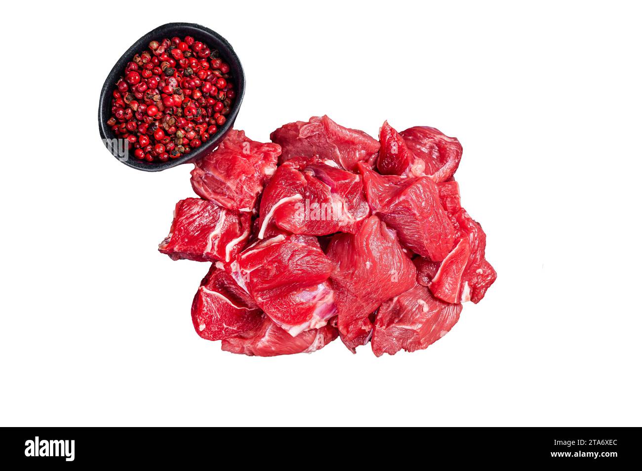 Raw diced red beef meat for Goulash on marble board. Isolated, white ...