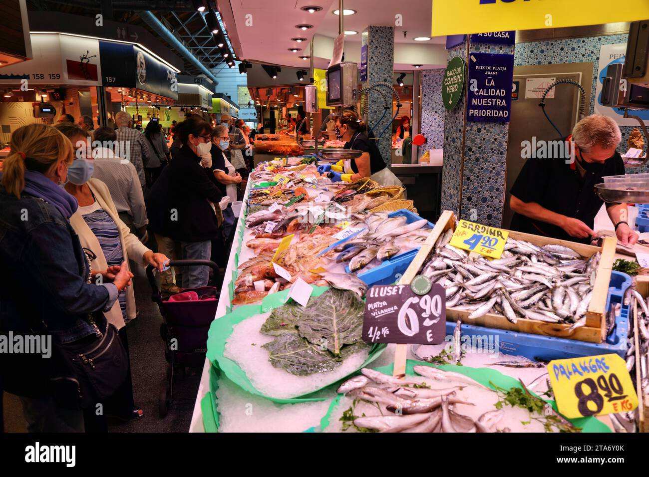 BARCELONA, SPAIN - OCTOBER 8, 2021: People visit local market hall ...